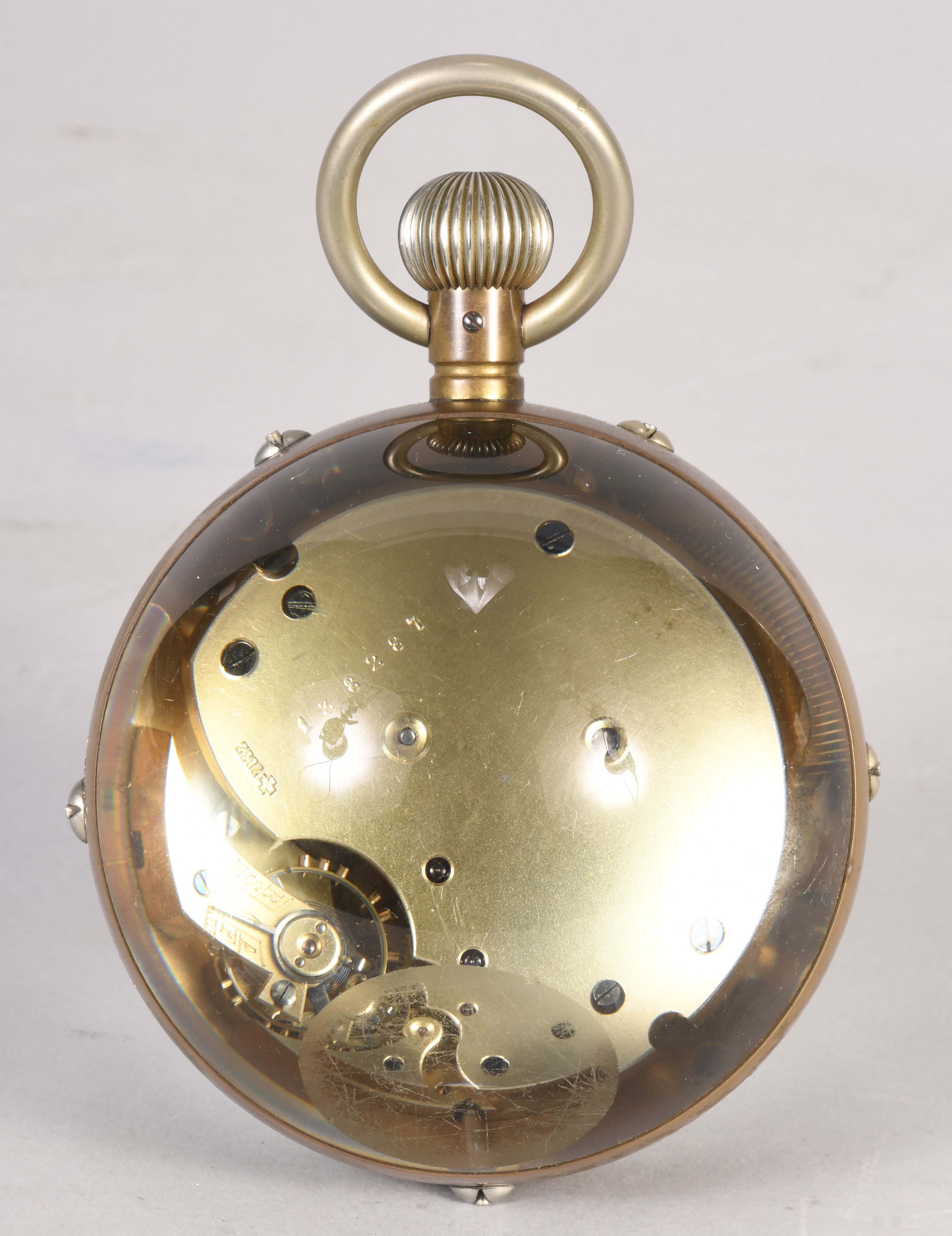 An early 20th century Swiss paperweight clock with calendar