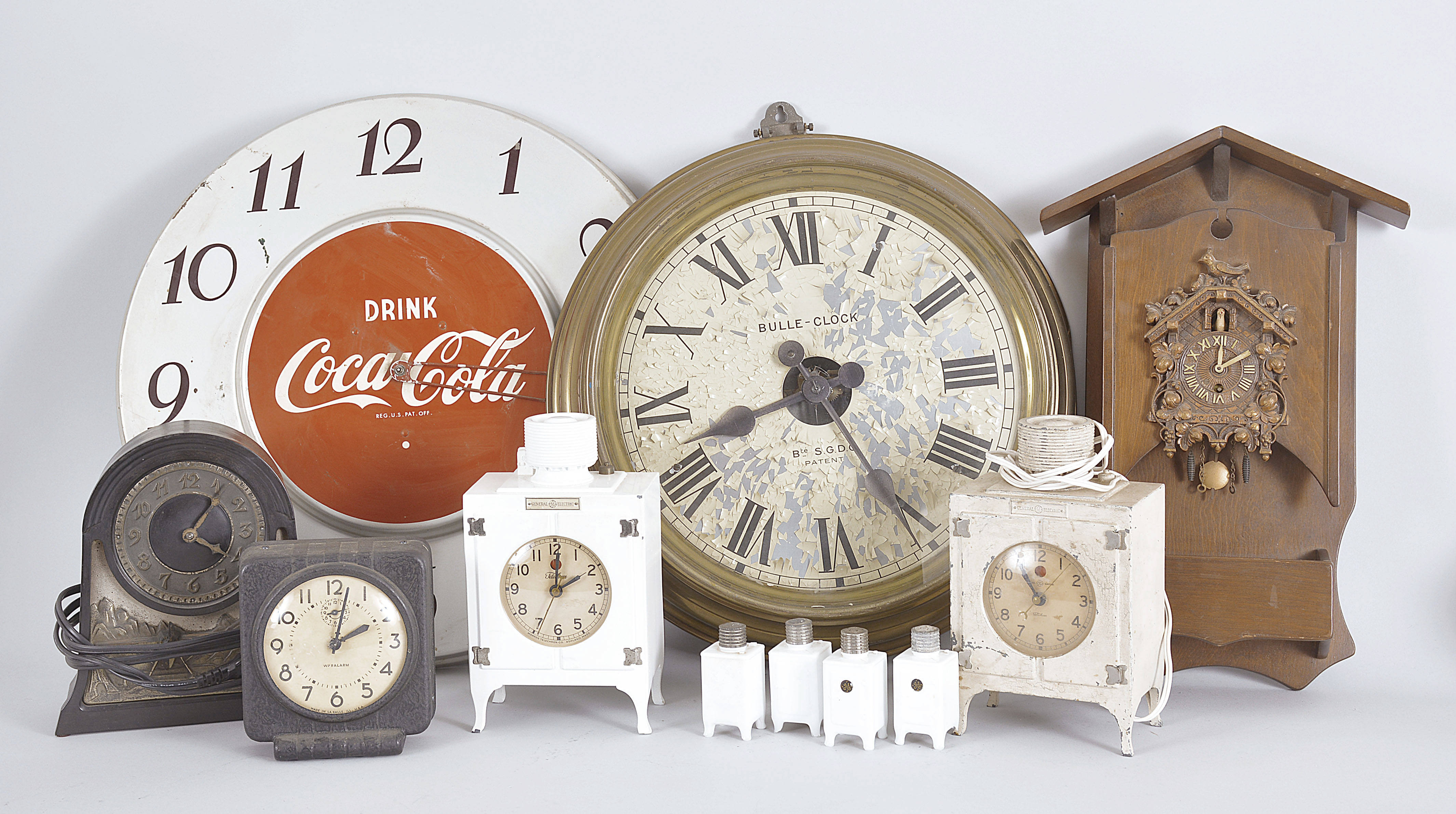 Ten clocks including Bulle and many electric advertising clocks