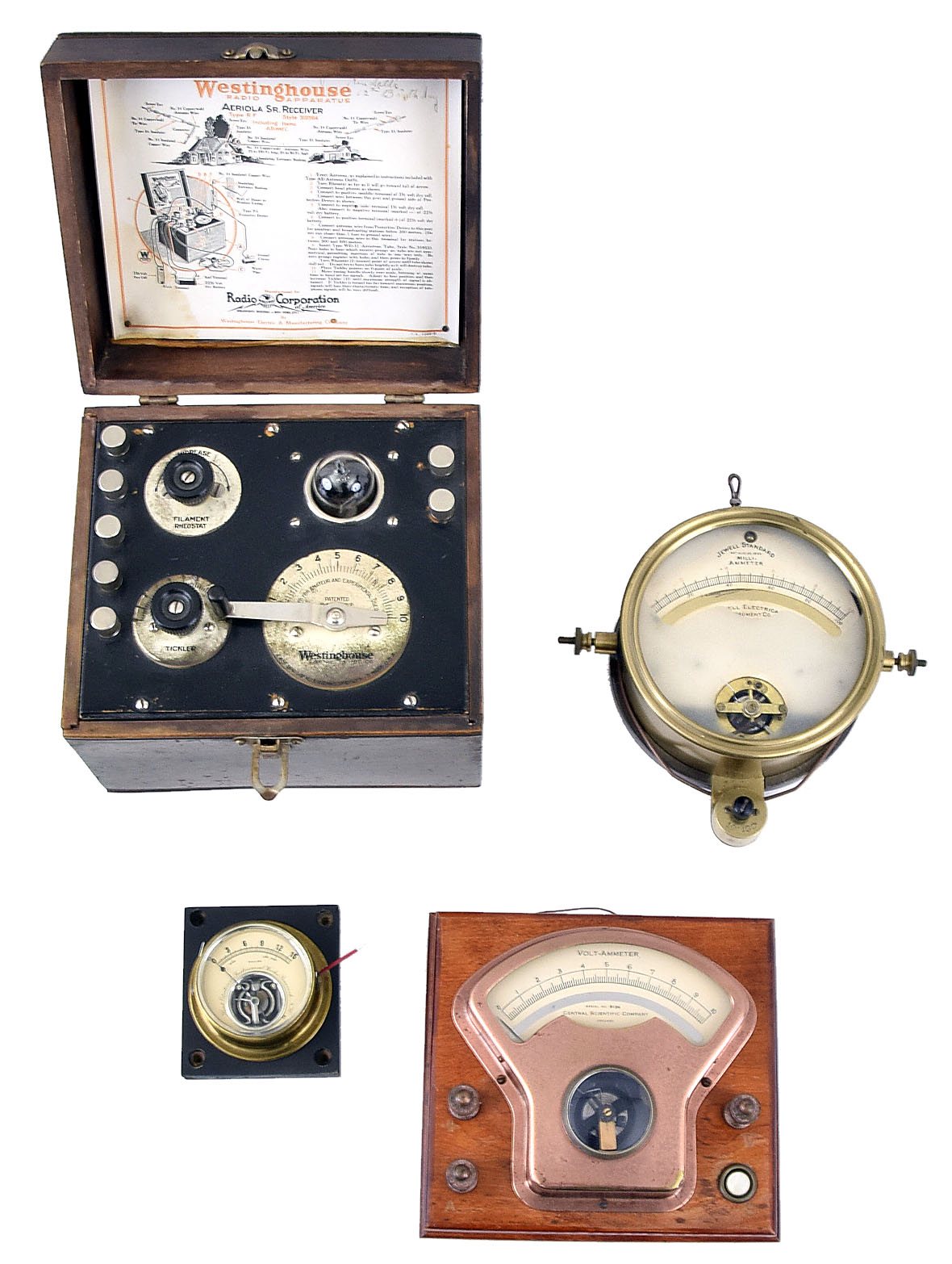 Four analog electrical meters and a Westinghouse radio receiver in wood ...