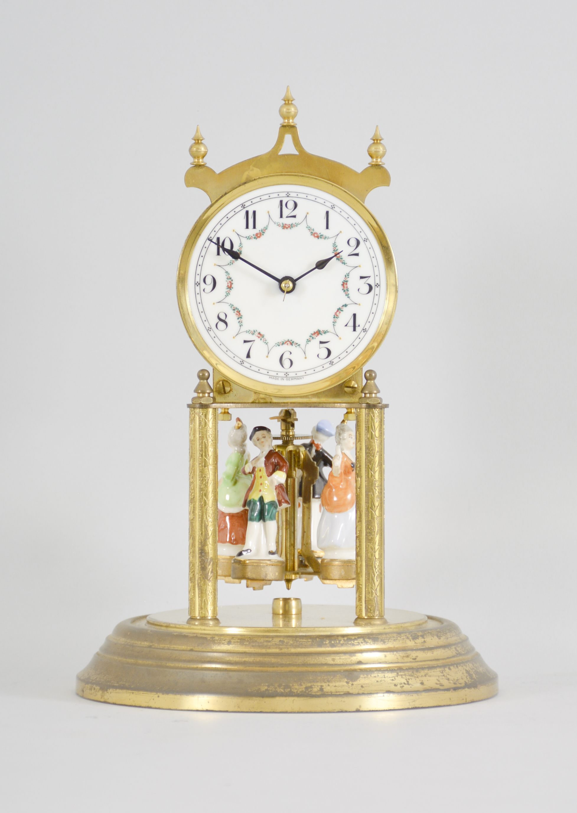 Forestville Clock Co. 400-day clock with four ceramic figures on the ...
