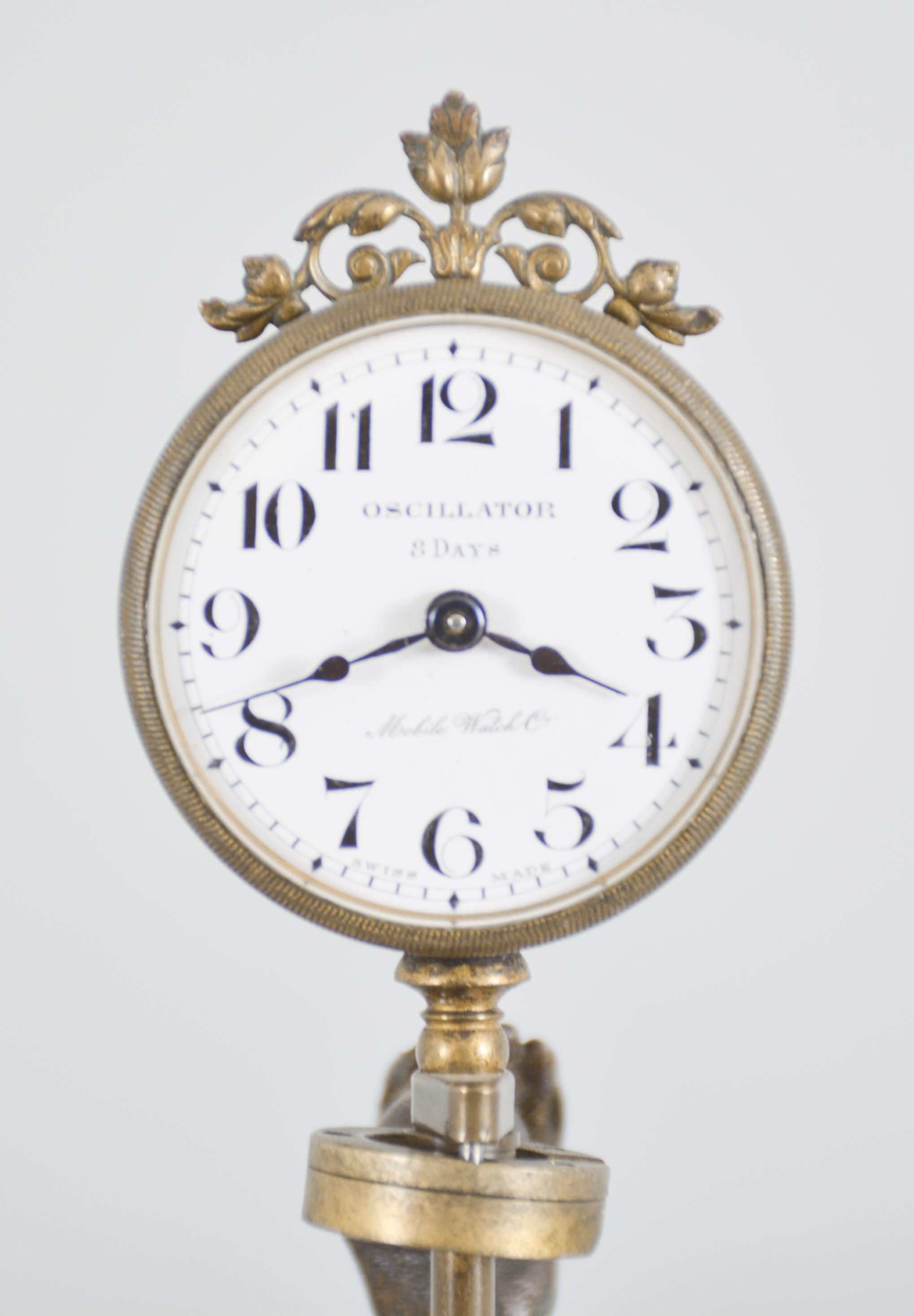 Swiss made "Oscillator" swinging mystery clock on patinated figure