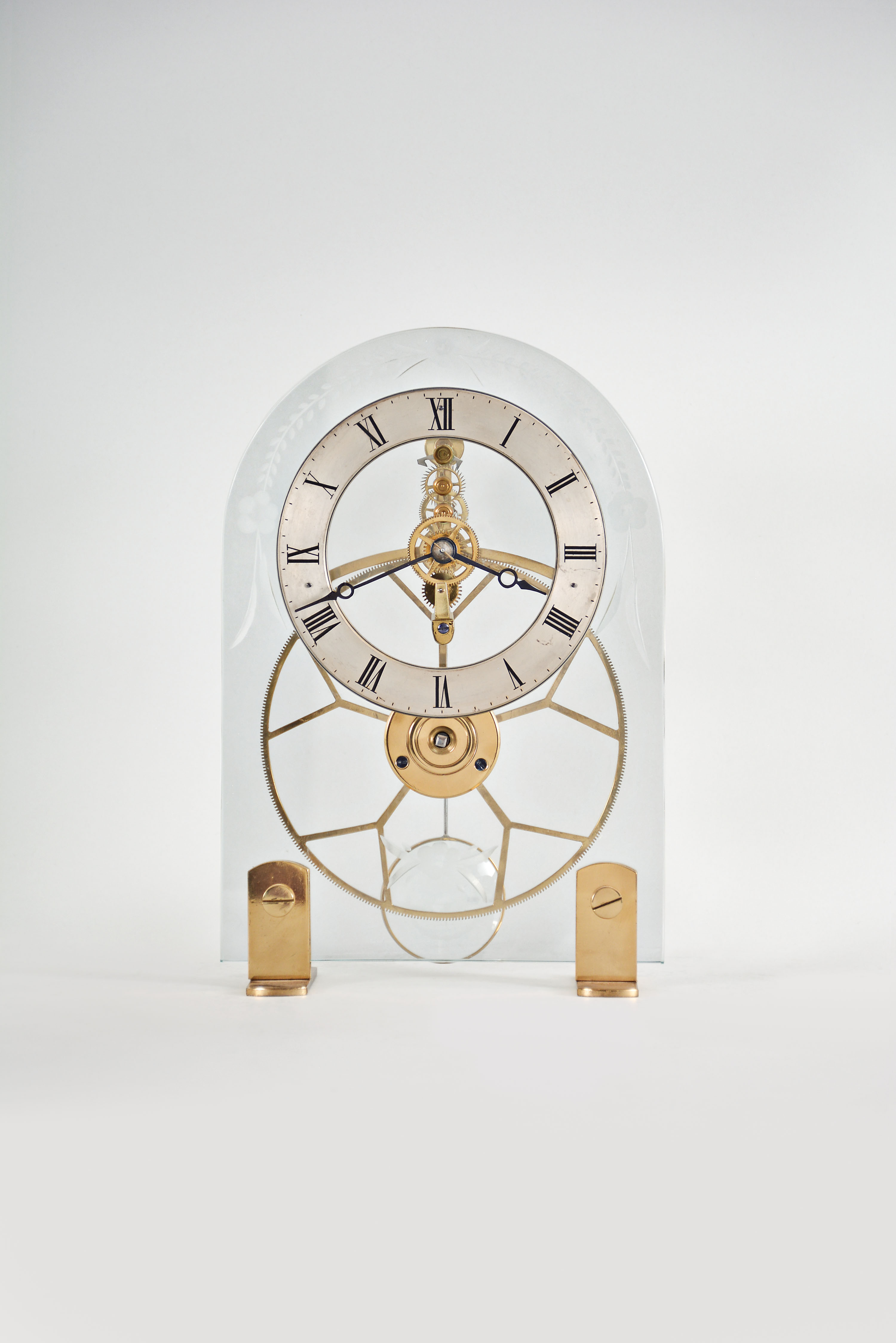 Reproduction skeleton clock mounted to etched glass plate