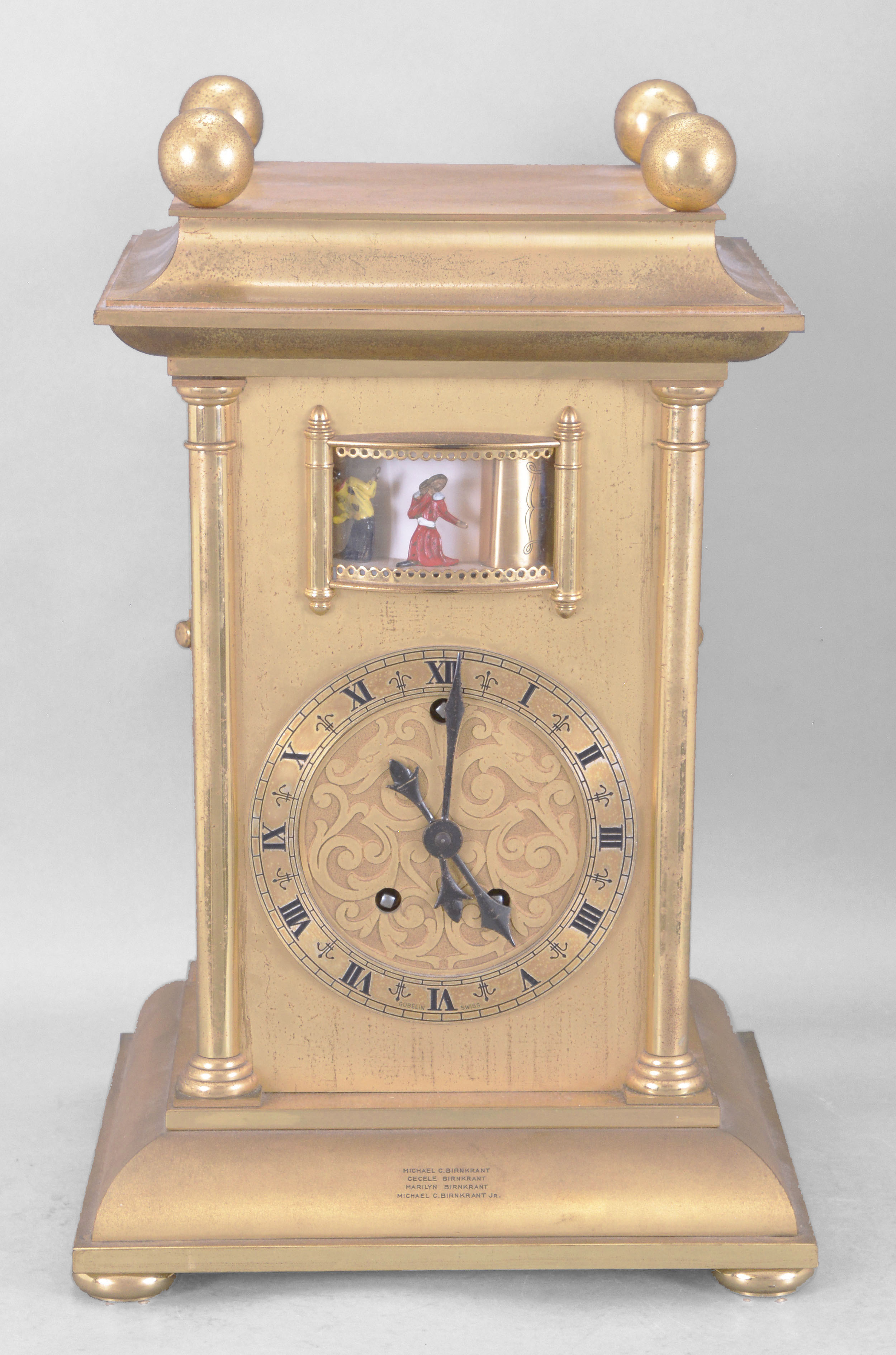 Large table clock with carousel of figures by Gubelin